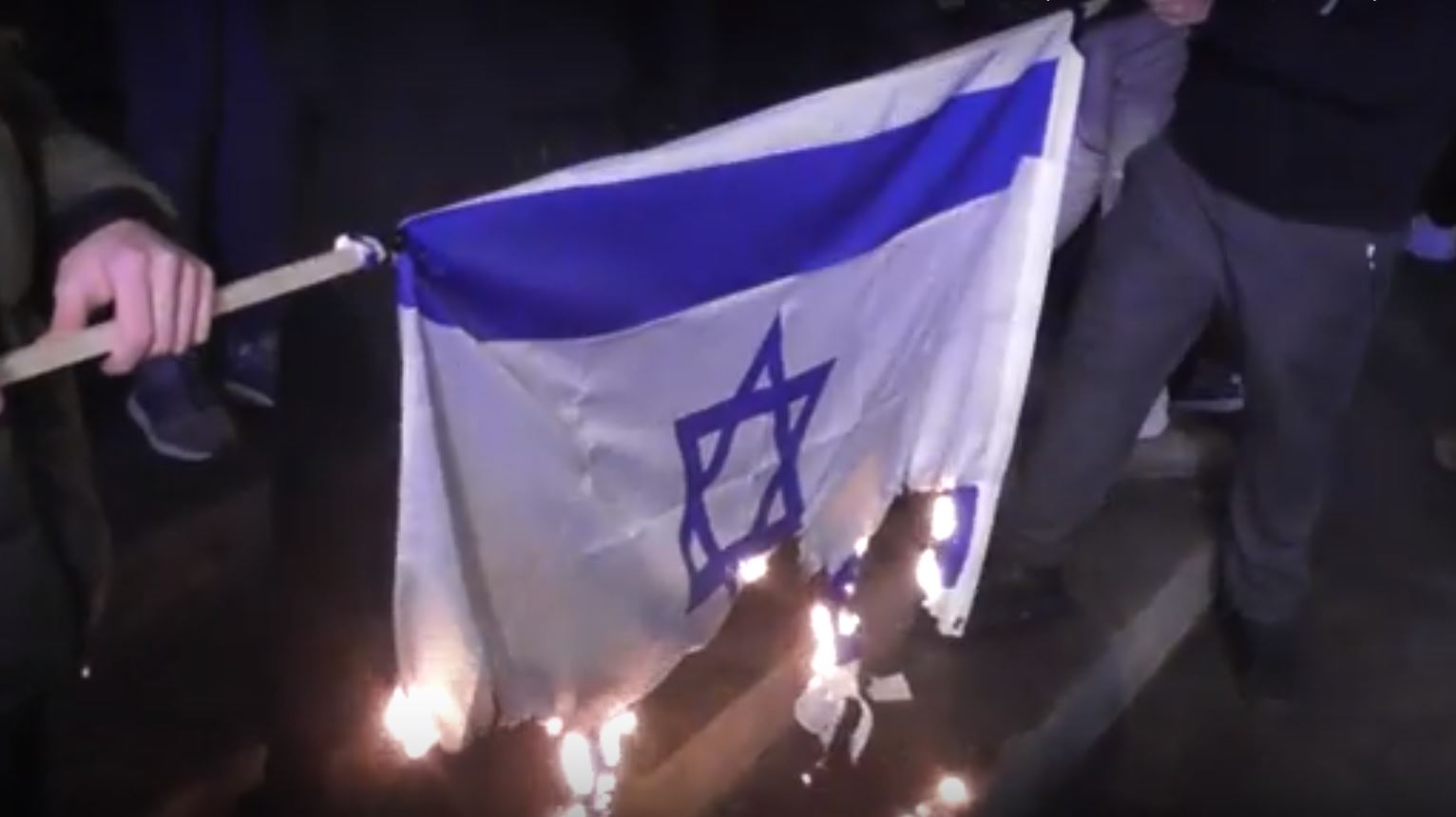 Israeli flag burned at central London protest