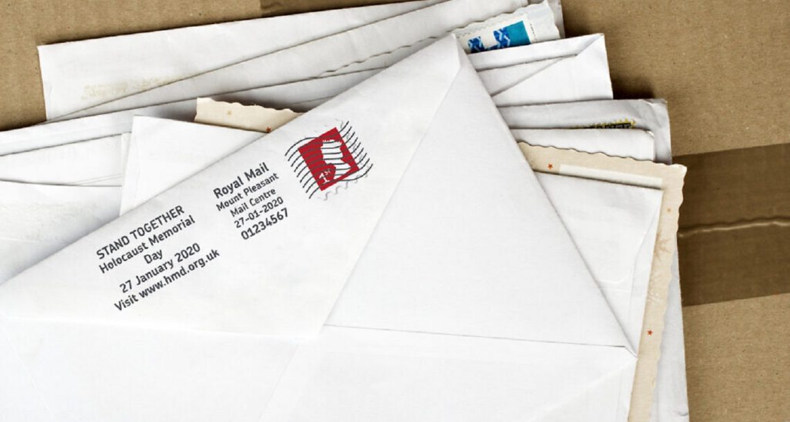 pile of letters and postal parcel