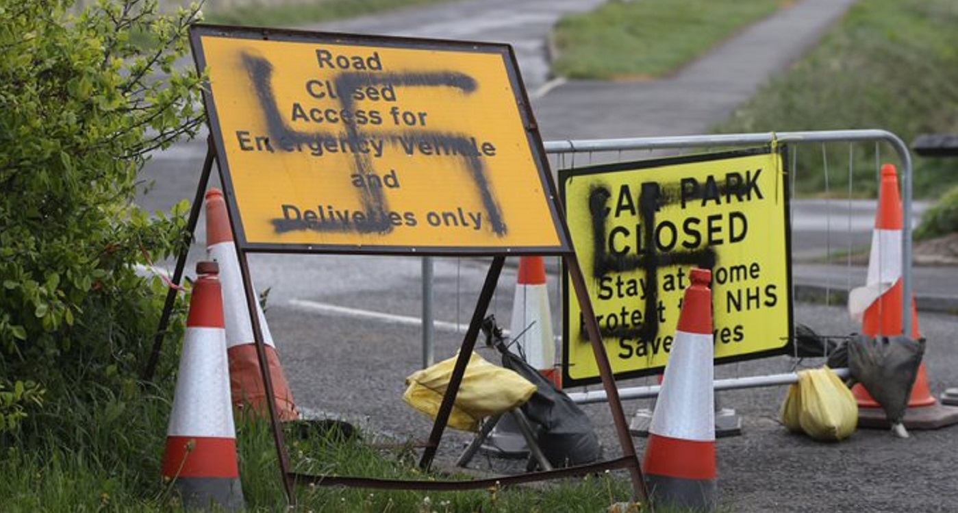 UK: Swastikas daubed on "Protect the NHS" and "Stay at home" road signs